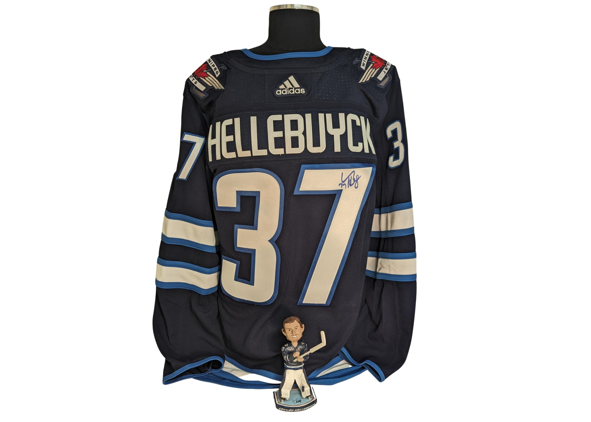 Hellebuyck Autographed Jersey, Bobblehead & Autographed Game-played stick