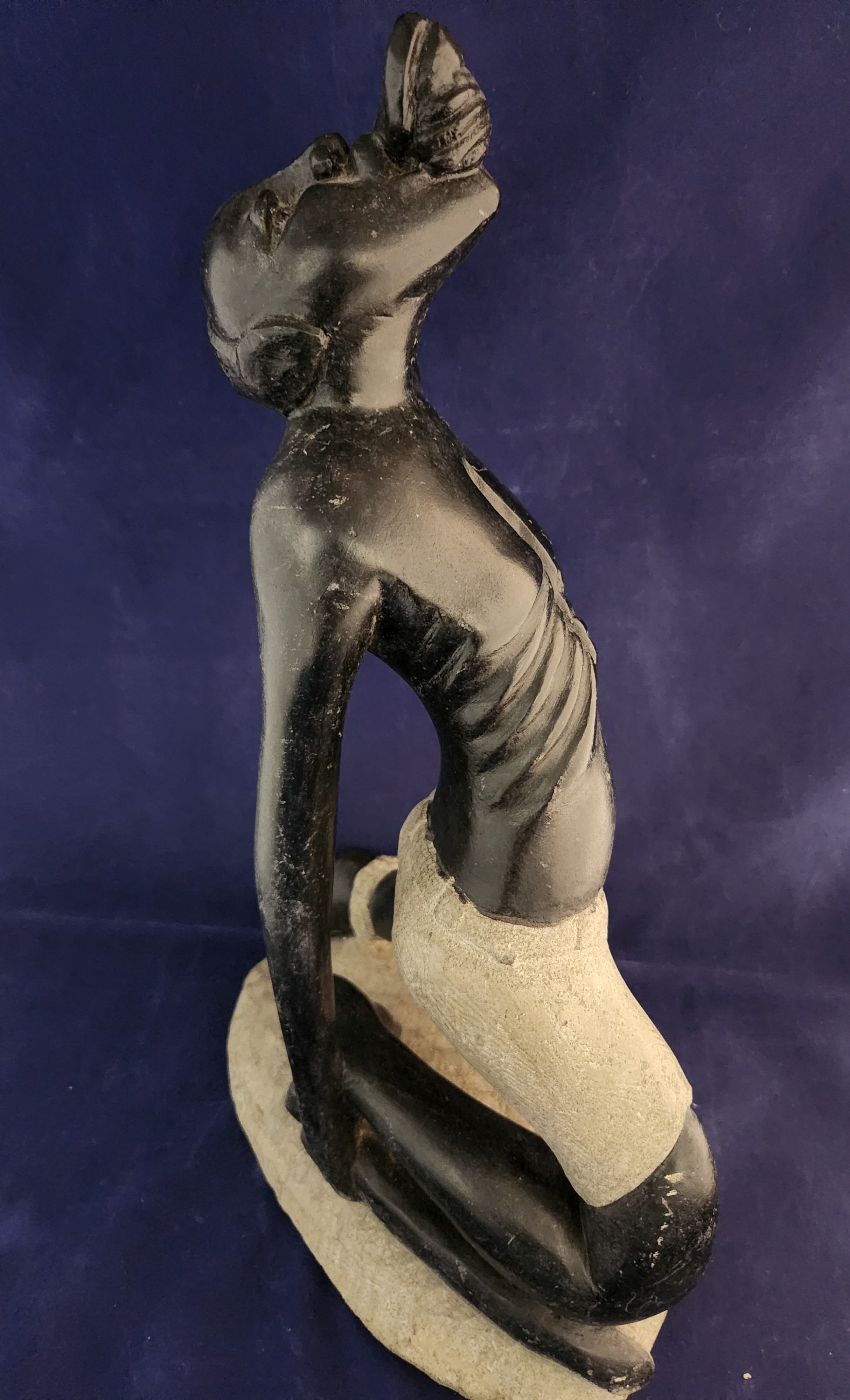 African Shackled Man Carved in Stone