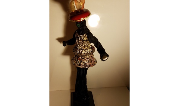 Moko Jumbie figurine, depicted in authentic Trinidad & Tobago costumes.